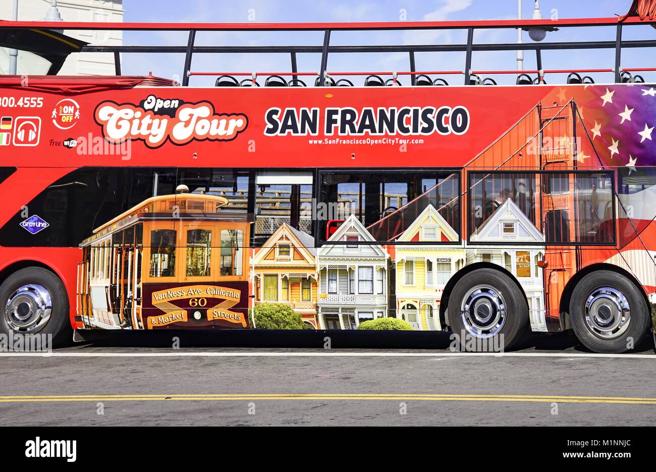 Pictures of the city decorate the red sightseeing buses in San ...