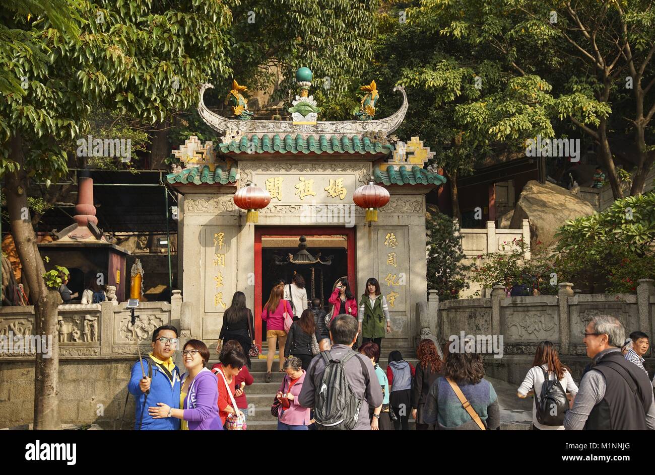 Visitors at the entrance of the A-Ma Temple in Macau. The temple ...