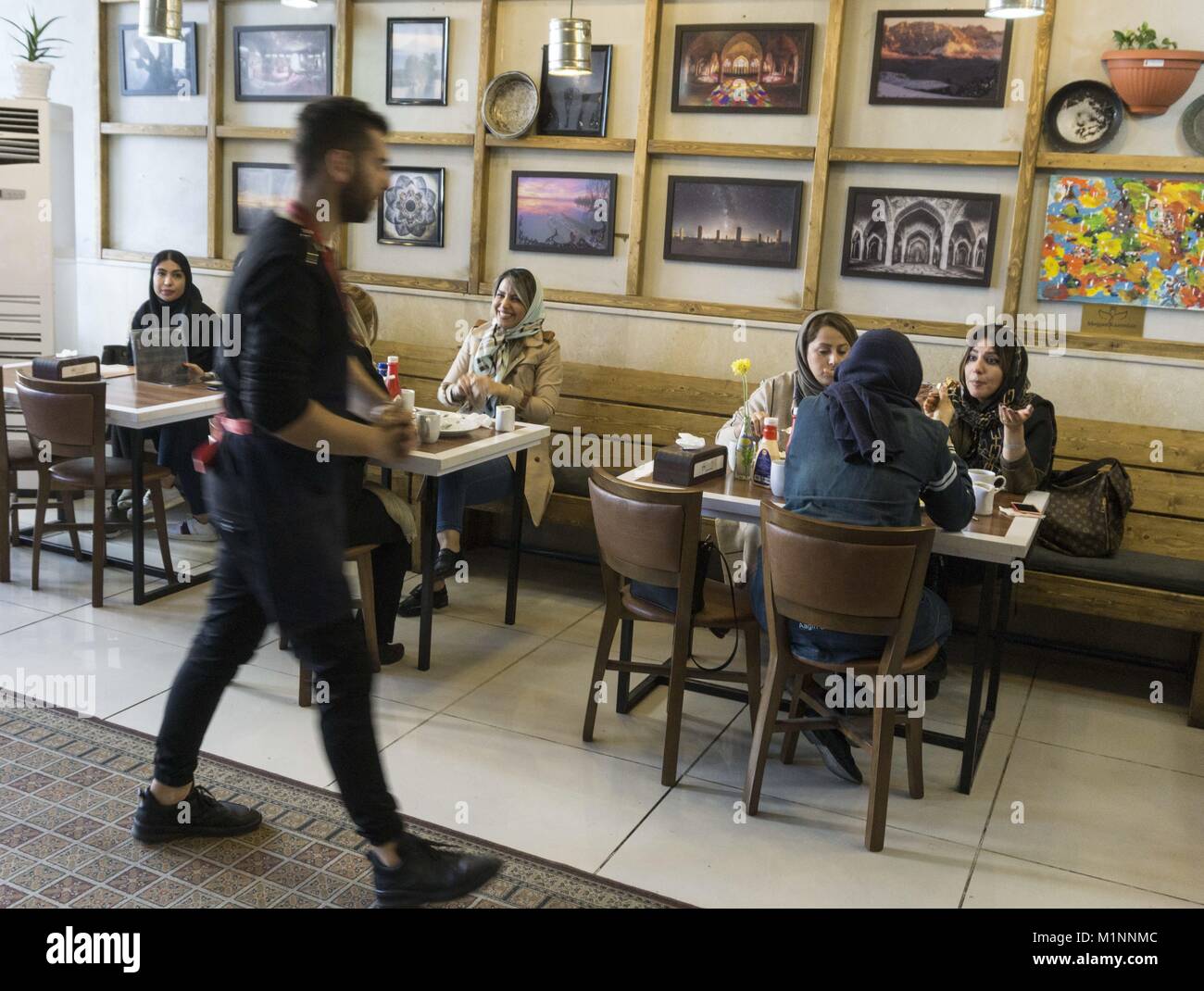 Iranian women sit in a cafe in Babol, Iran, 28 November 2017. | usage ...