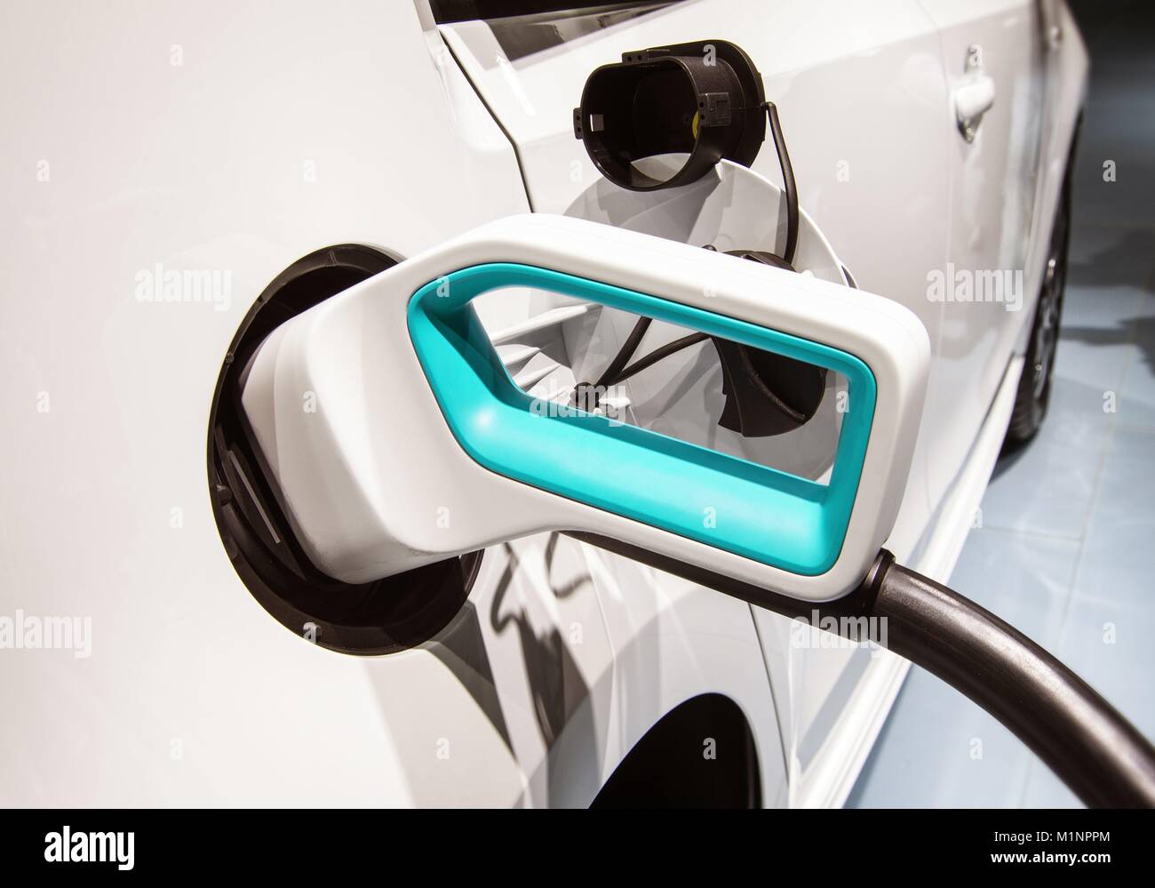 Detail of an electric car with green plug | usage worldwide Stock Photo ...
