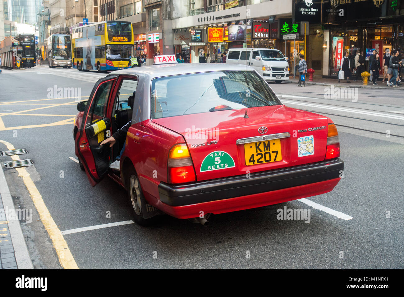 Hong kong red taxi hi-res stock photography and images - Alamy