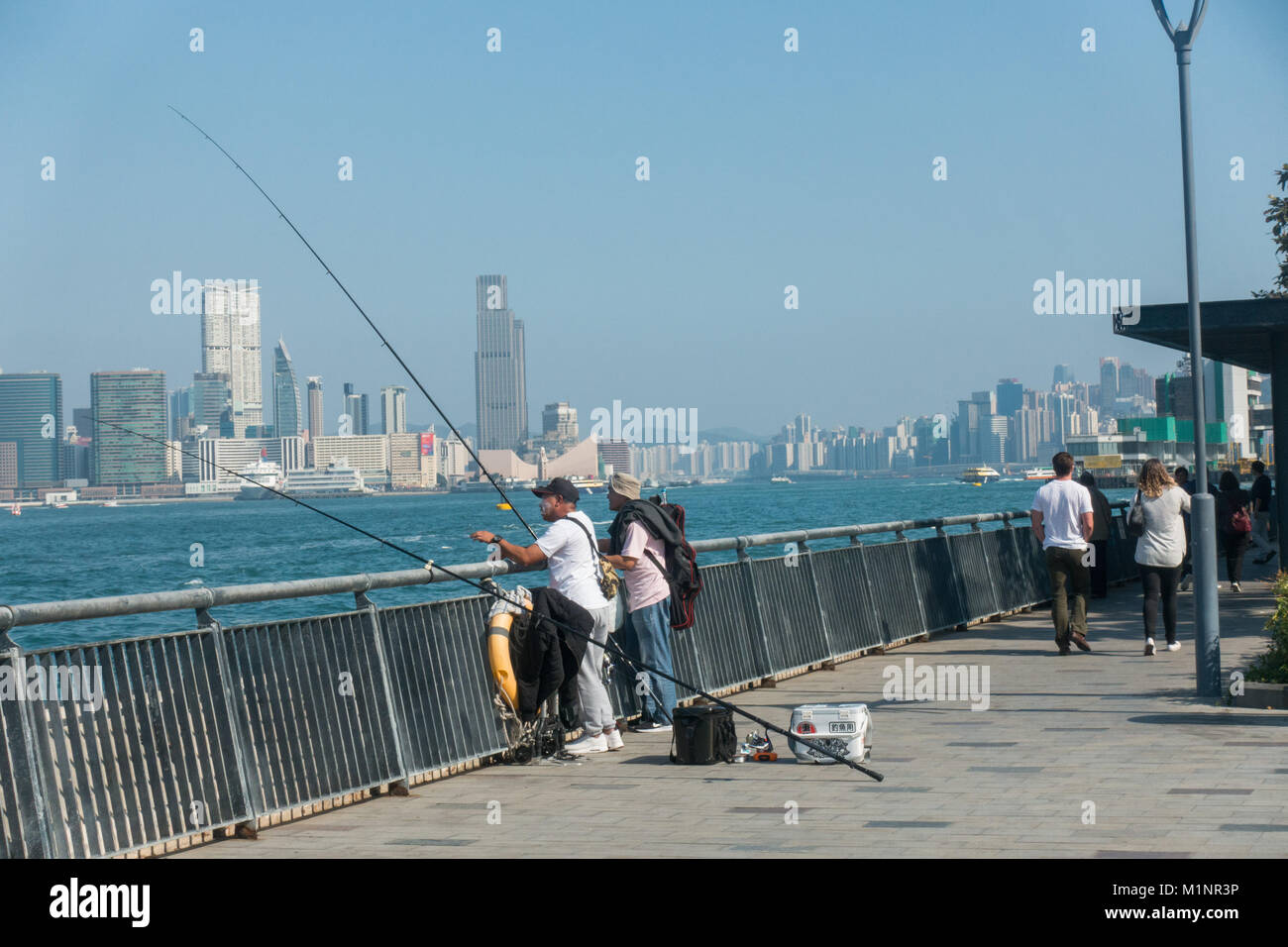 Hong Kong men fishing Stock Photo - Alamy
