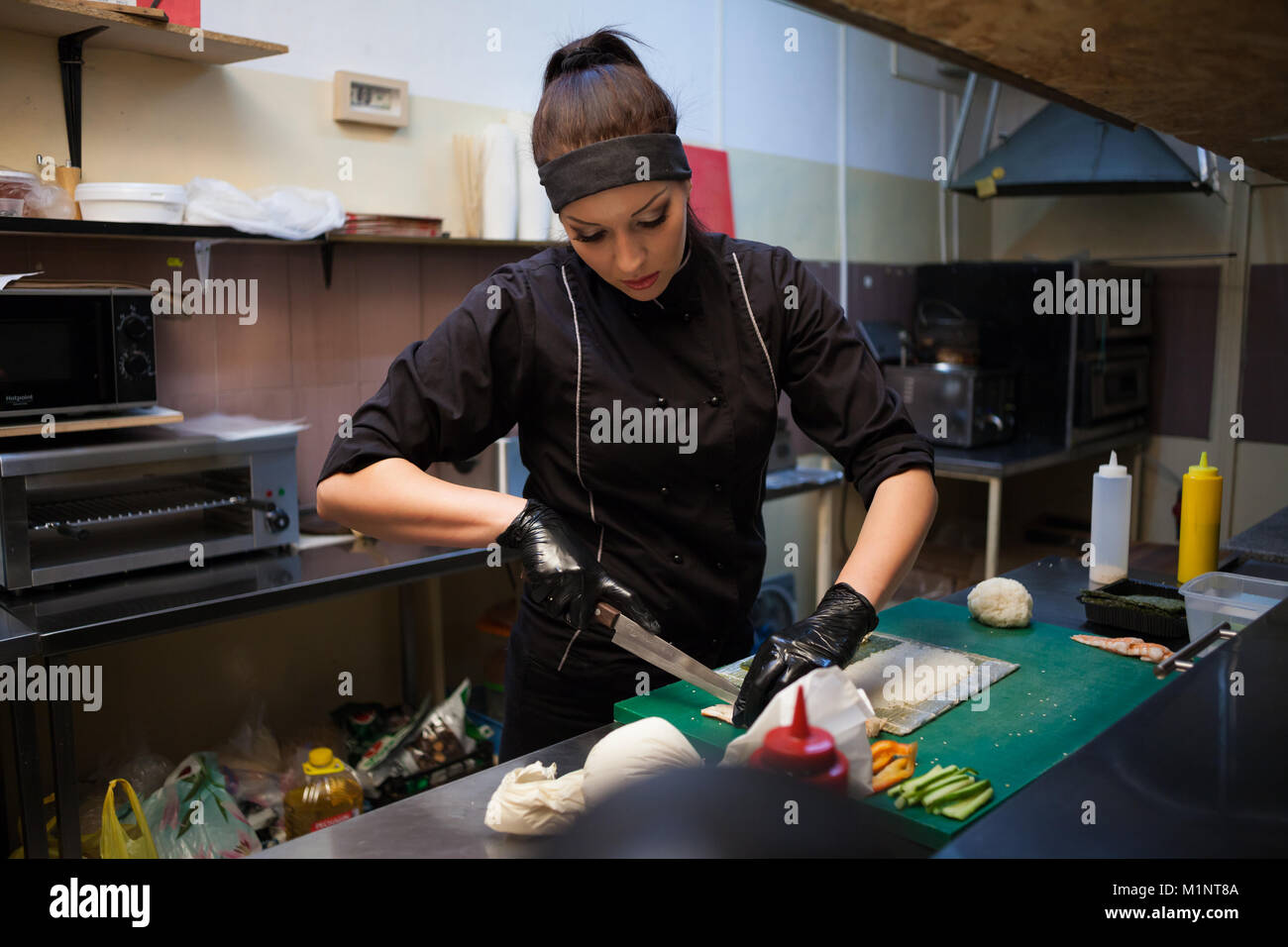 Woman making sashimi hi-res stock photography and images - Alamy