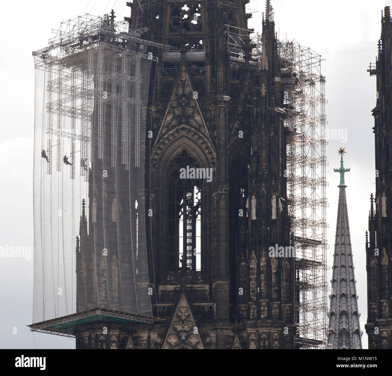 Germany, Cologne, workers mounting a new scaffold at the northern ...