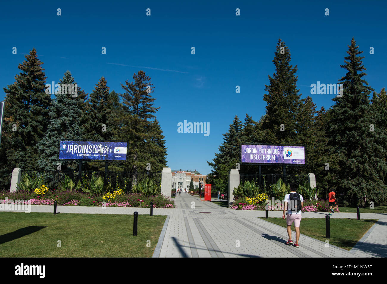 Olympic park Montreal Jardins Garden sign signs house trees pine sky ...