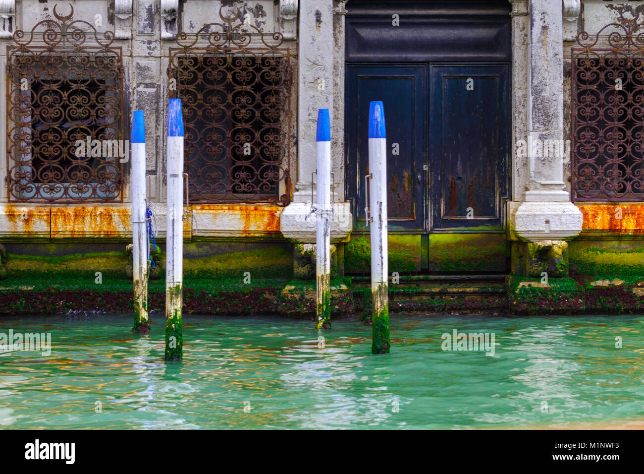 VENICE, ITALY - on May 5, 2016. Enigmatically colorful wooden door on ...