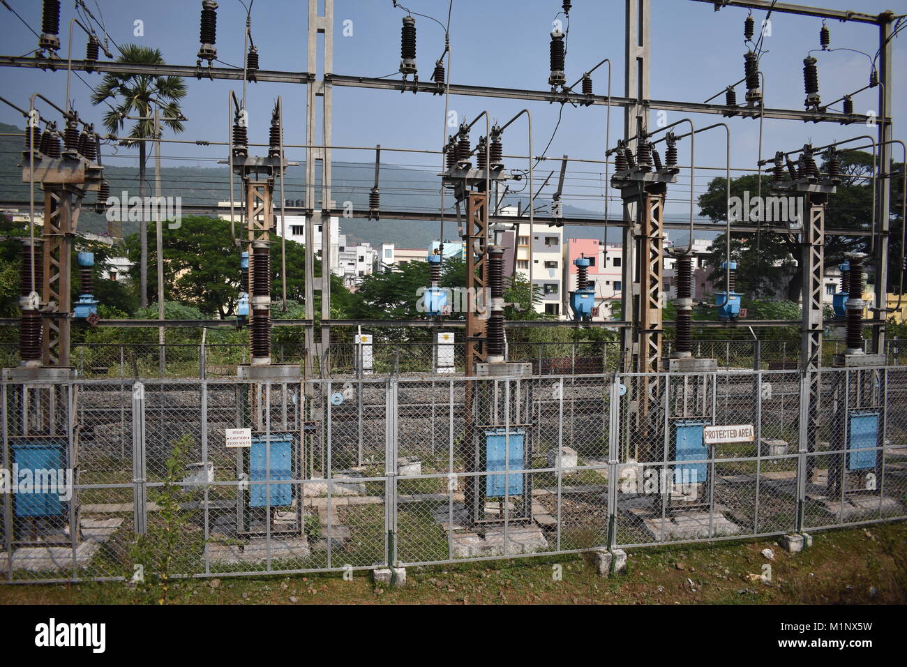 A transformer yard close view with background city building Stock Photo ...