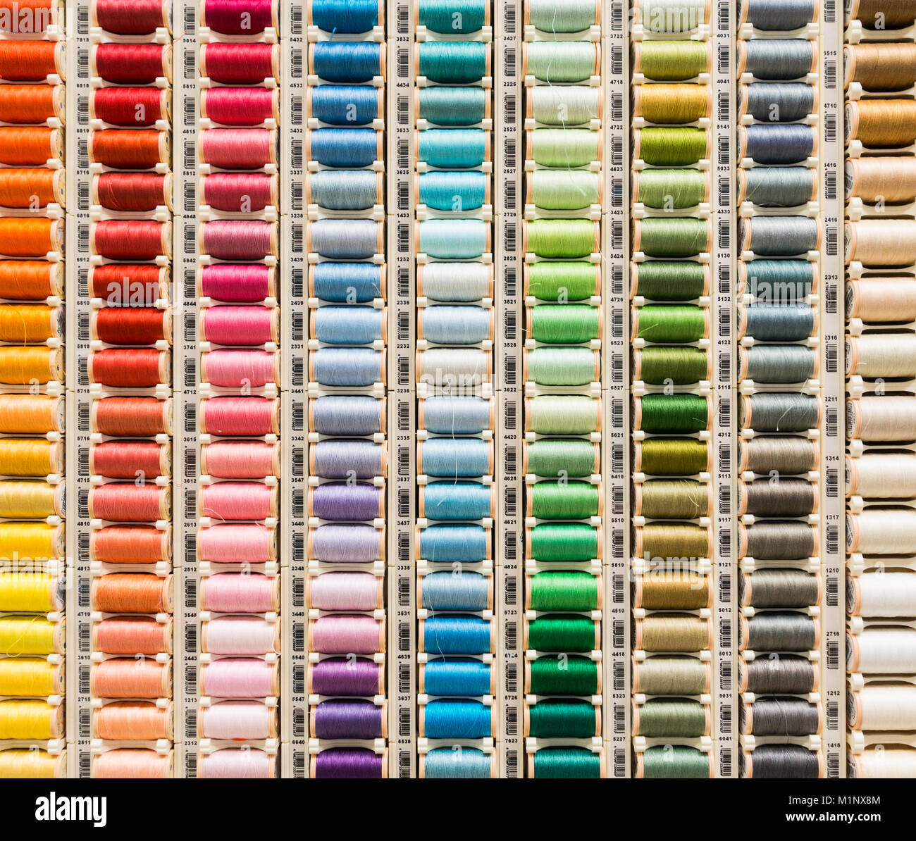 Coloured cotton reels displal haberdashery shop Stock Photo - Alamy