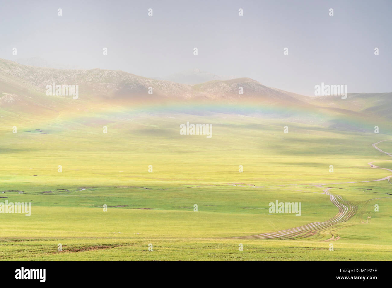 Rainbow over the green Mongolian steppe, Ovorkhangai province, Mongolia ...