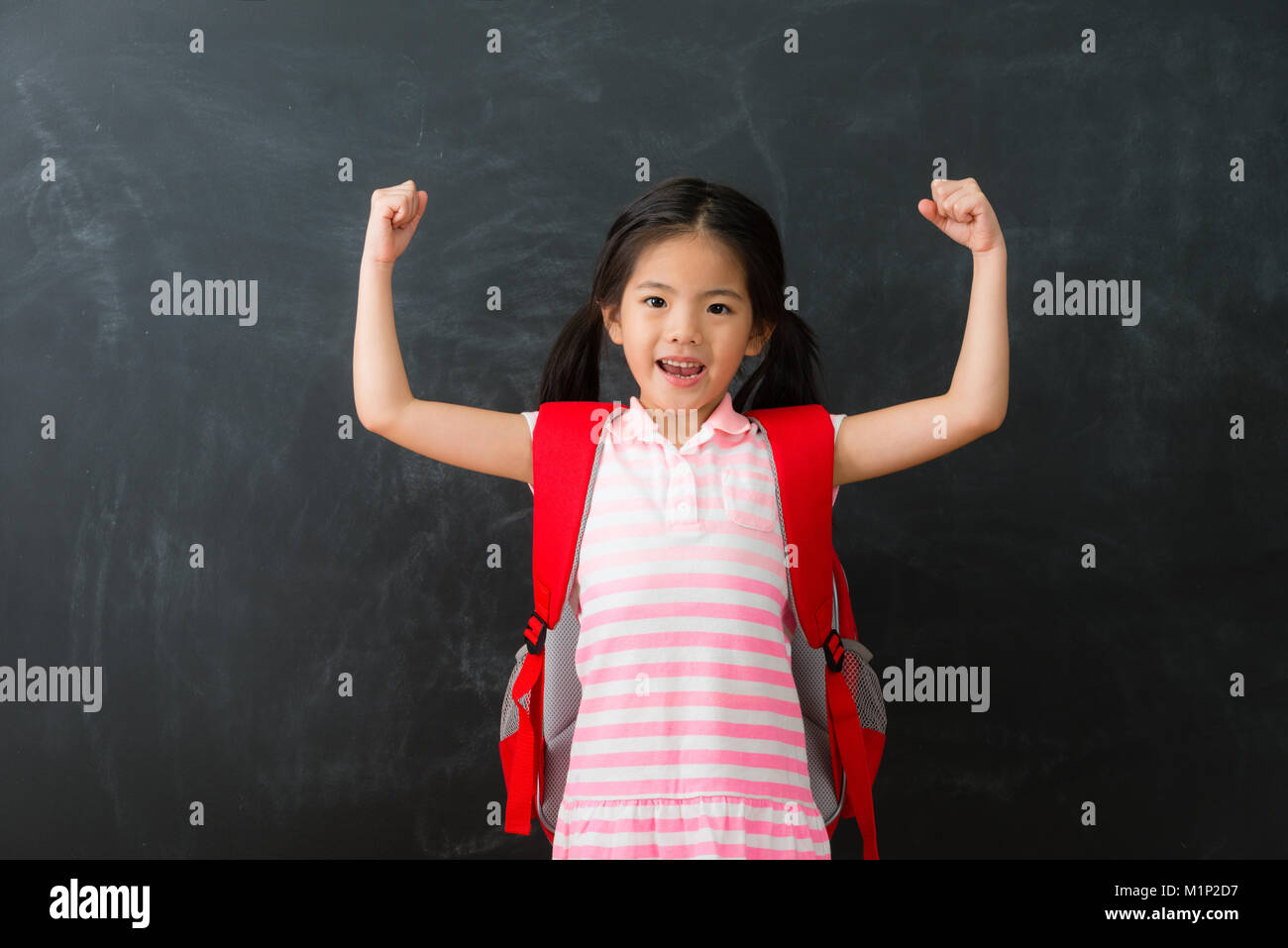 young beautiful little girl student successful finished homework ready back to school studying ...