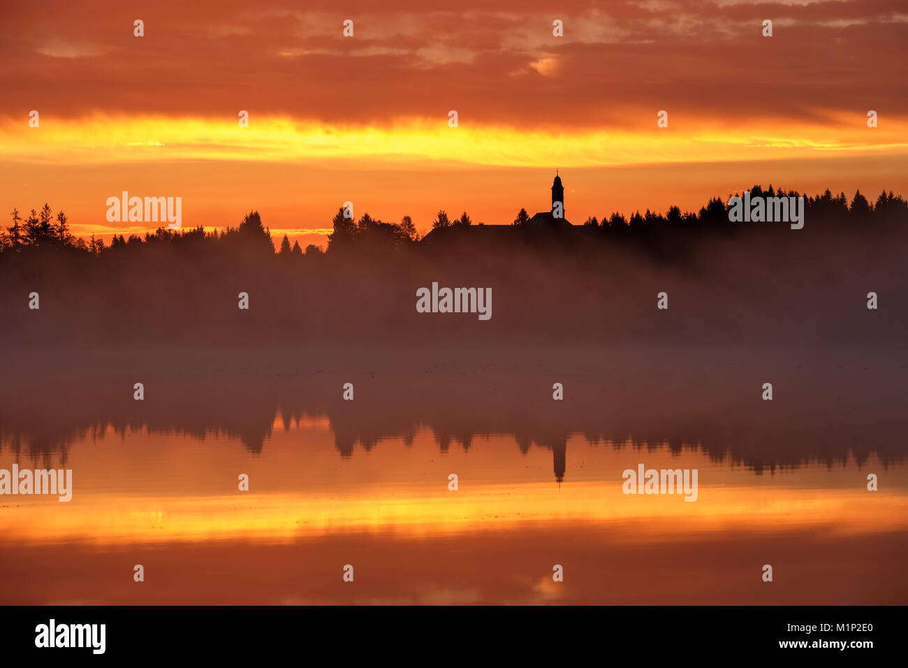 Sunrise,dawn,early morning fog over Kirchsee with Reutberg Monastery ...
