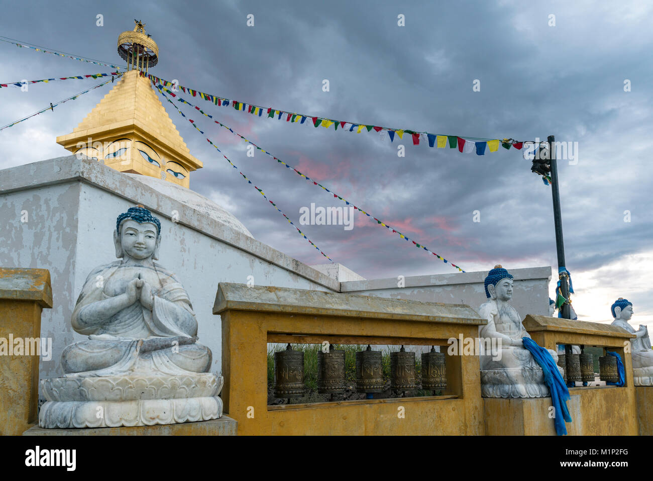 Buddhist statues at Amarbayasgalant Monastery at sunset, Mount Buren ...