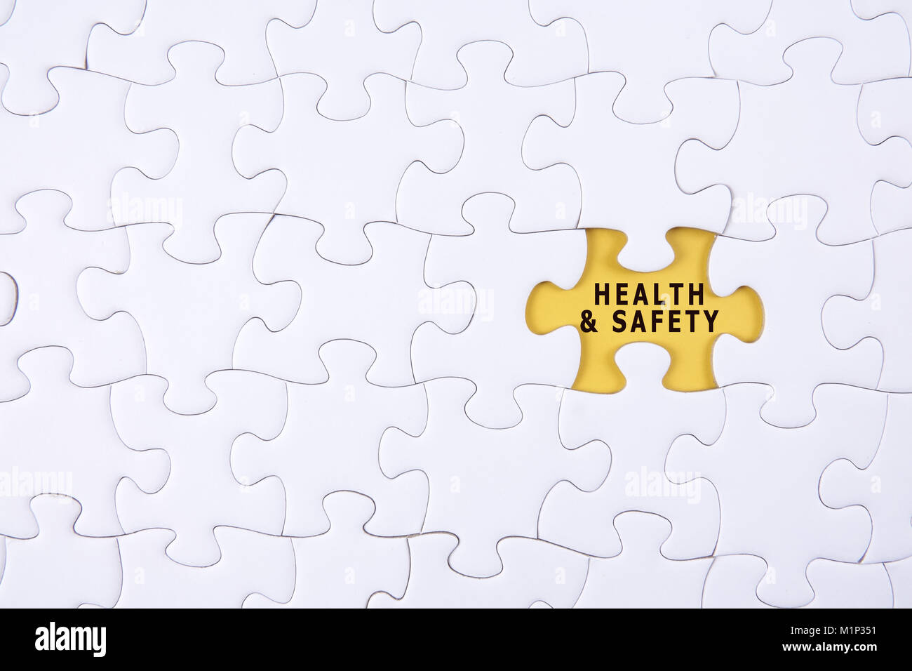 HEALTH AND SAFETY CONCEPT with white jigsaw puzzle Stock Photo - Alamy