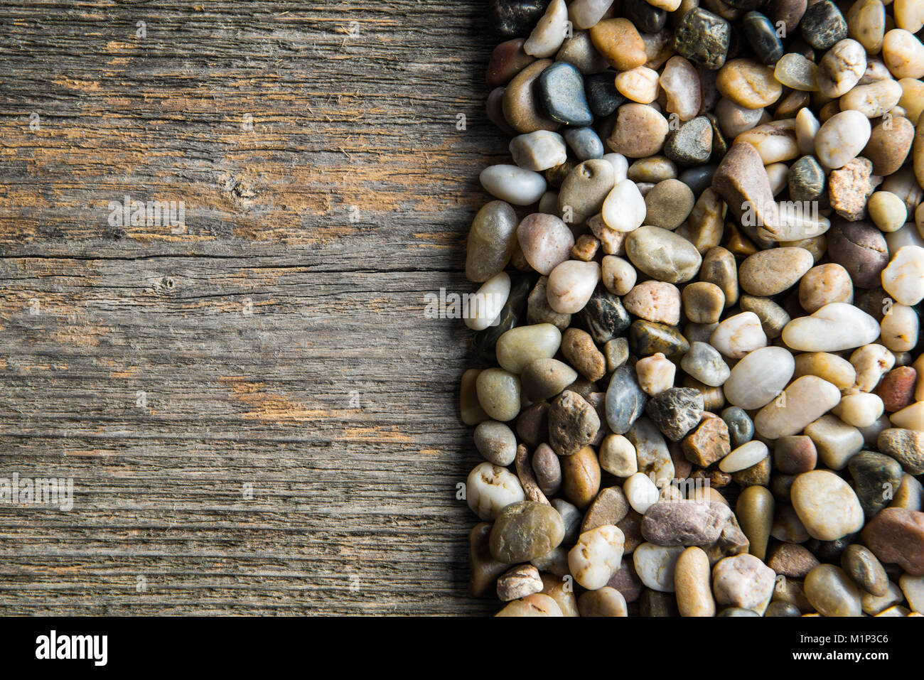 Wood and stones in different colors and shapes Stock Photo - Alamy
