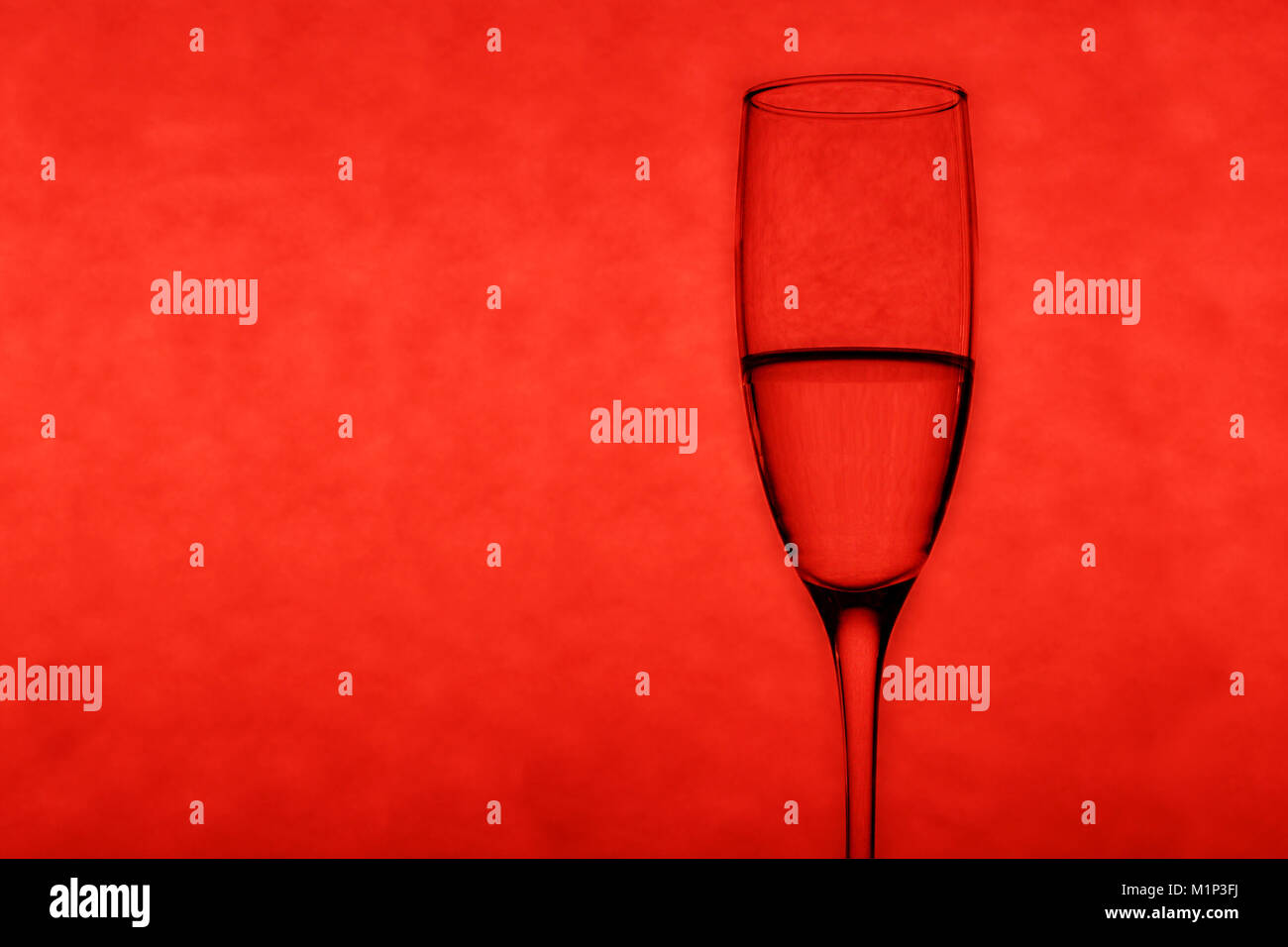 A closeup of an glass with a deep red background Stock Photo - Alamy