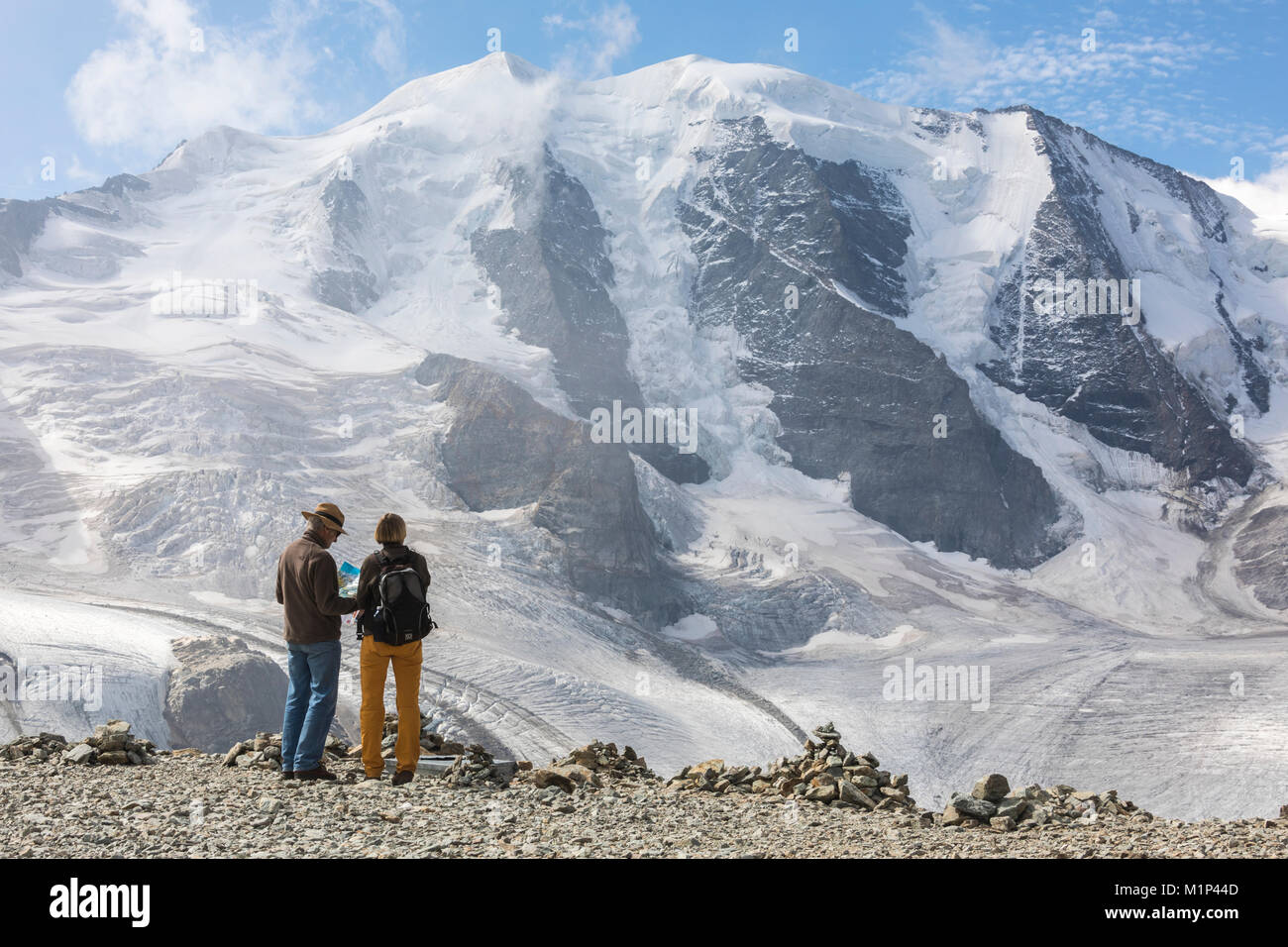 Tourists admire the Diavolezza and Pers glaciers and Piz Palu, St ...