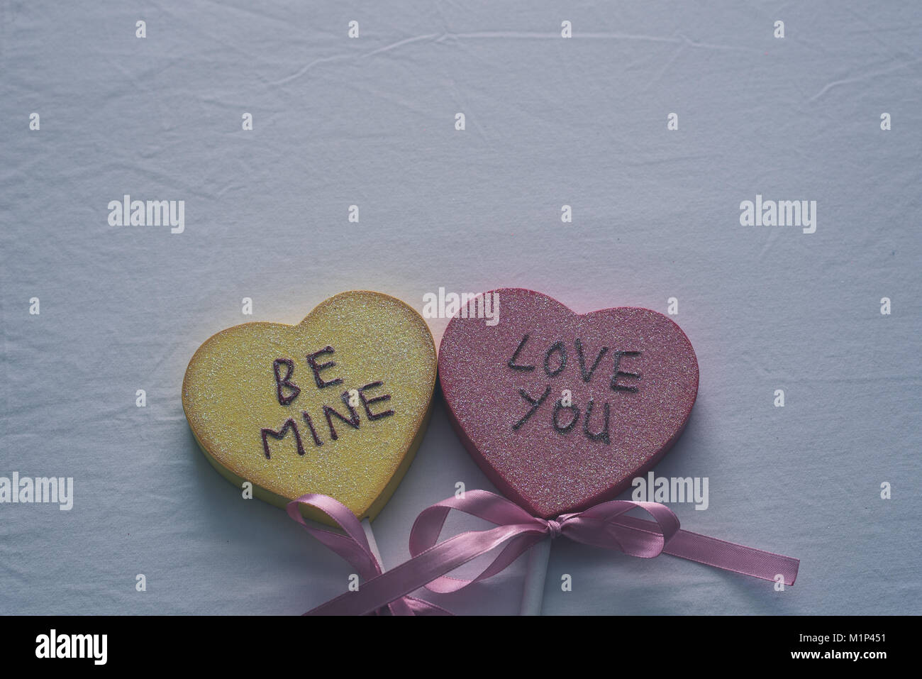 Be mine and Love you hearts with a white background leaving text space ...