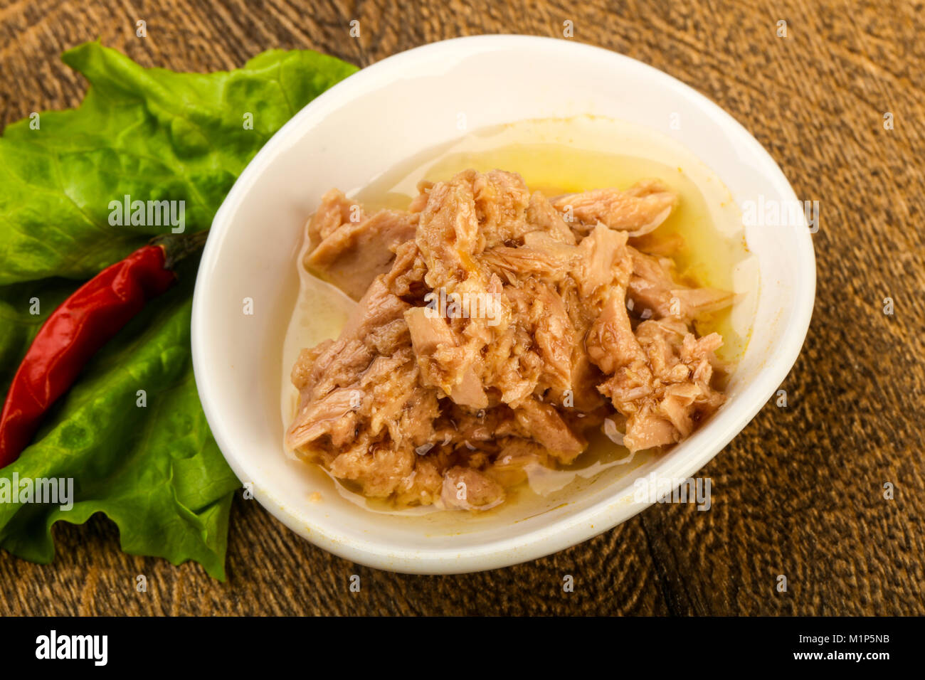 Canned tuna fish in the bowl ready for cooking Stock Photo - Alamy