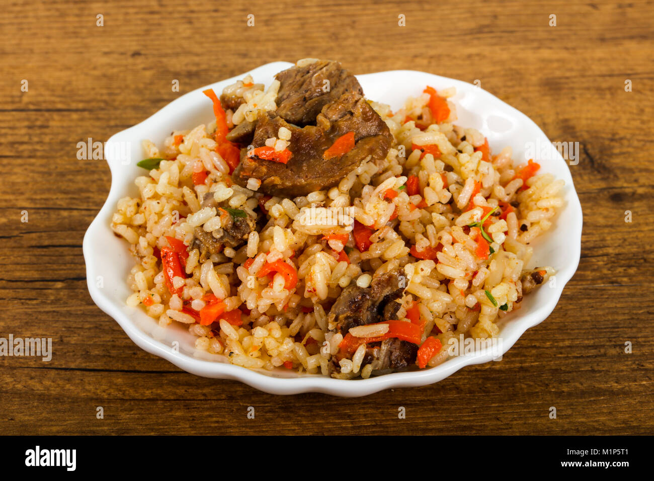 Asian rice - Plov with meat and carrot Stock Photo - Alamy