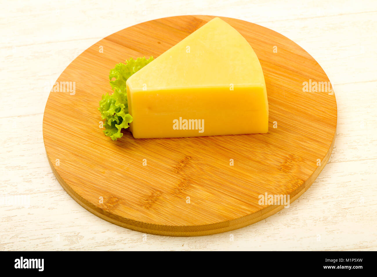 Parmesan cheese triangle Stock Photo - Alamy