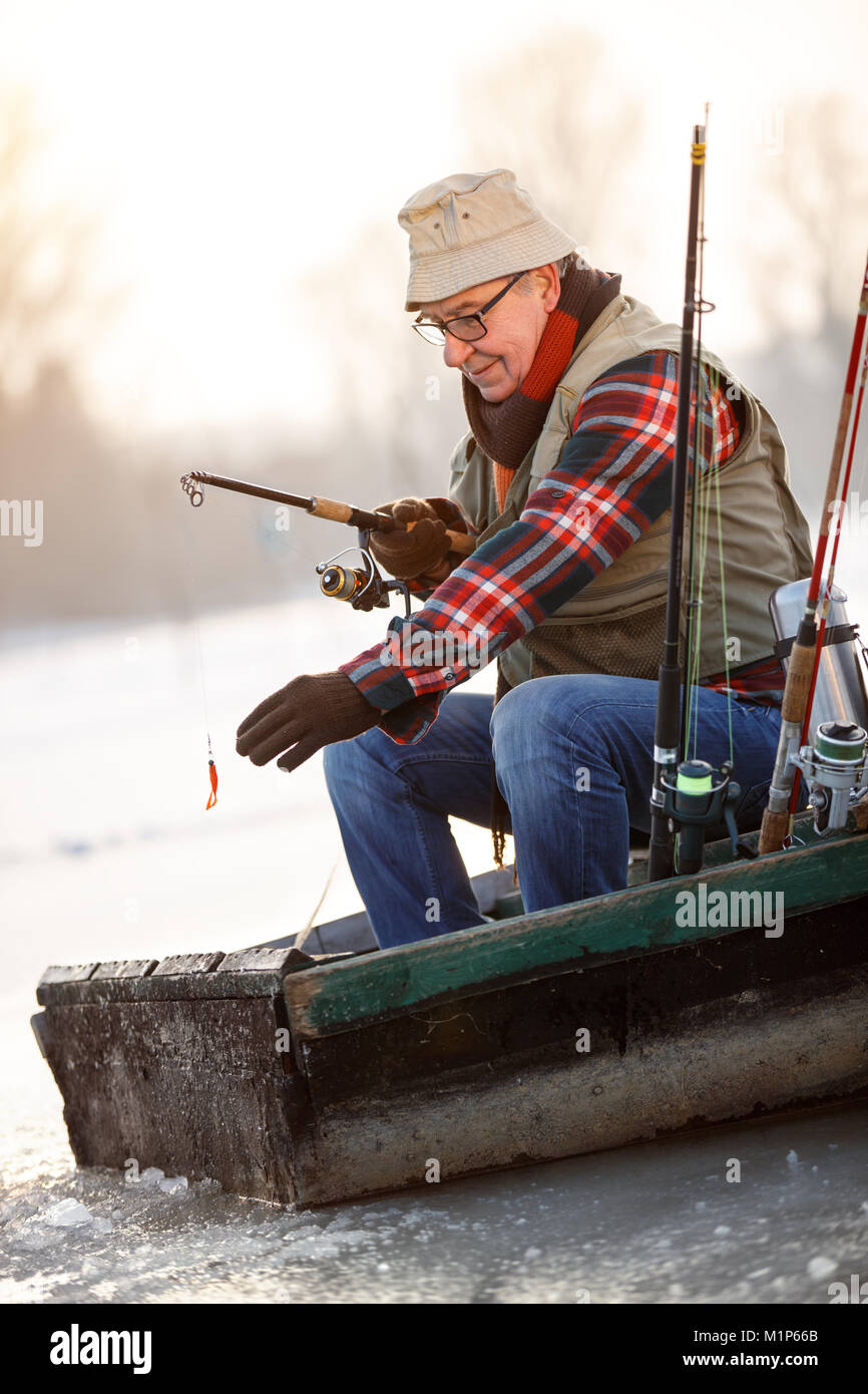 Old man fishing on river with bait Stock Photo - Alamy