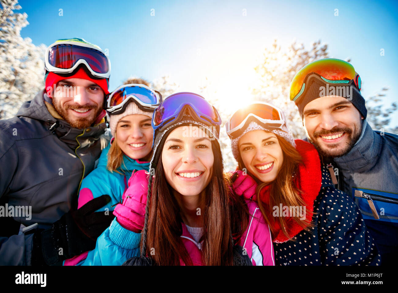 portrait group of smiling friends skiers on winter holidays Stock Photo ...