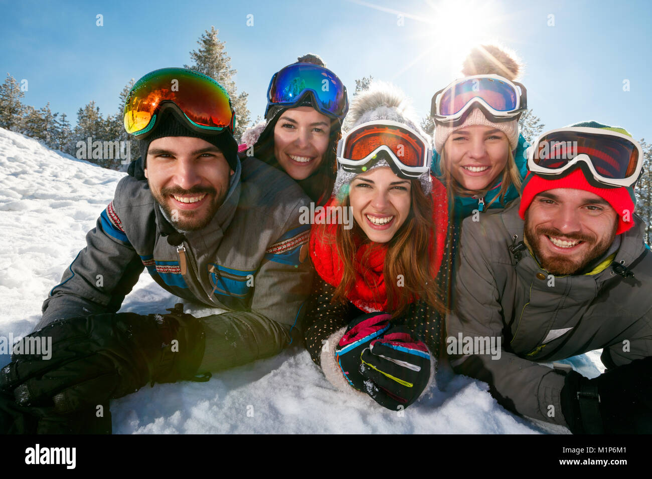 Group of friends having fun on ski holiday in mountains Stock Photo - Alamy