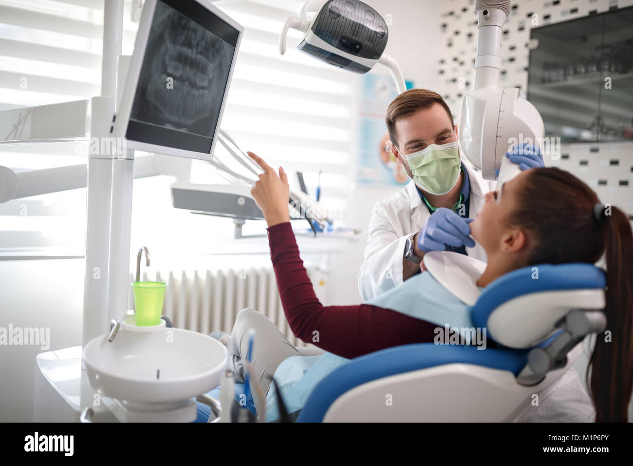 Male dentist making x-ray to patient and checkup teeth Stock Photo - Alamy
