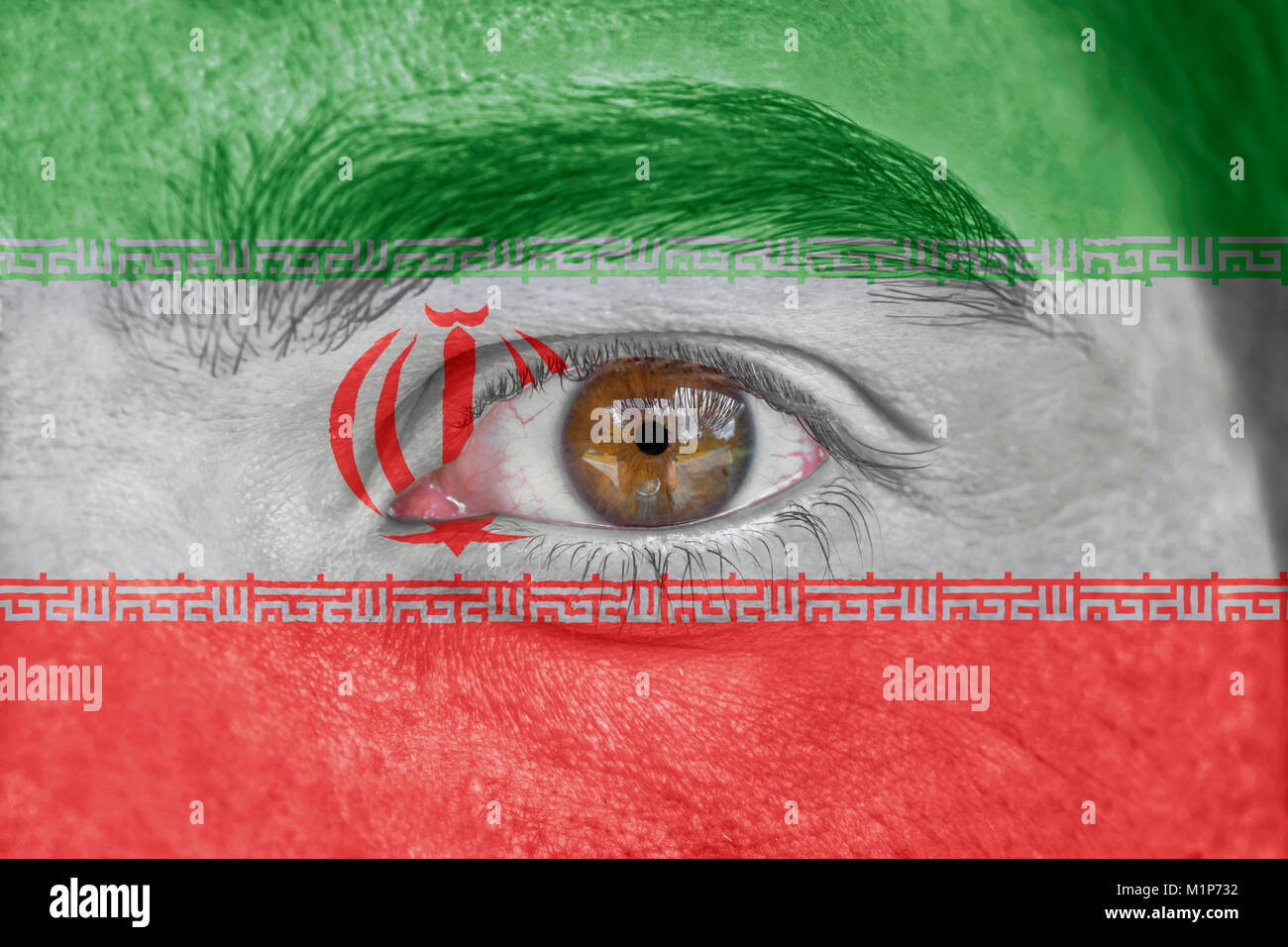 Human face and eye painted with flag of Iran Stock Photo - Alamy