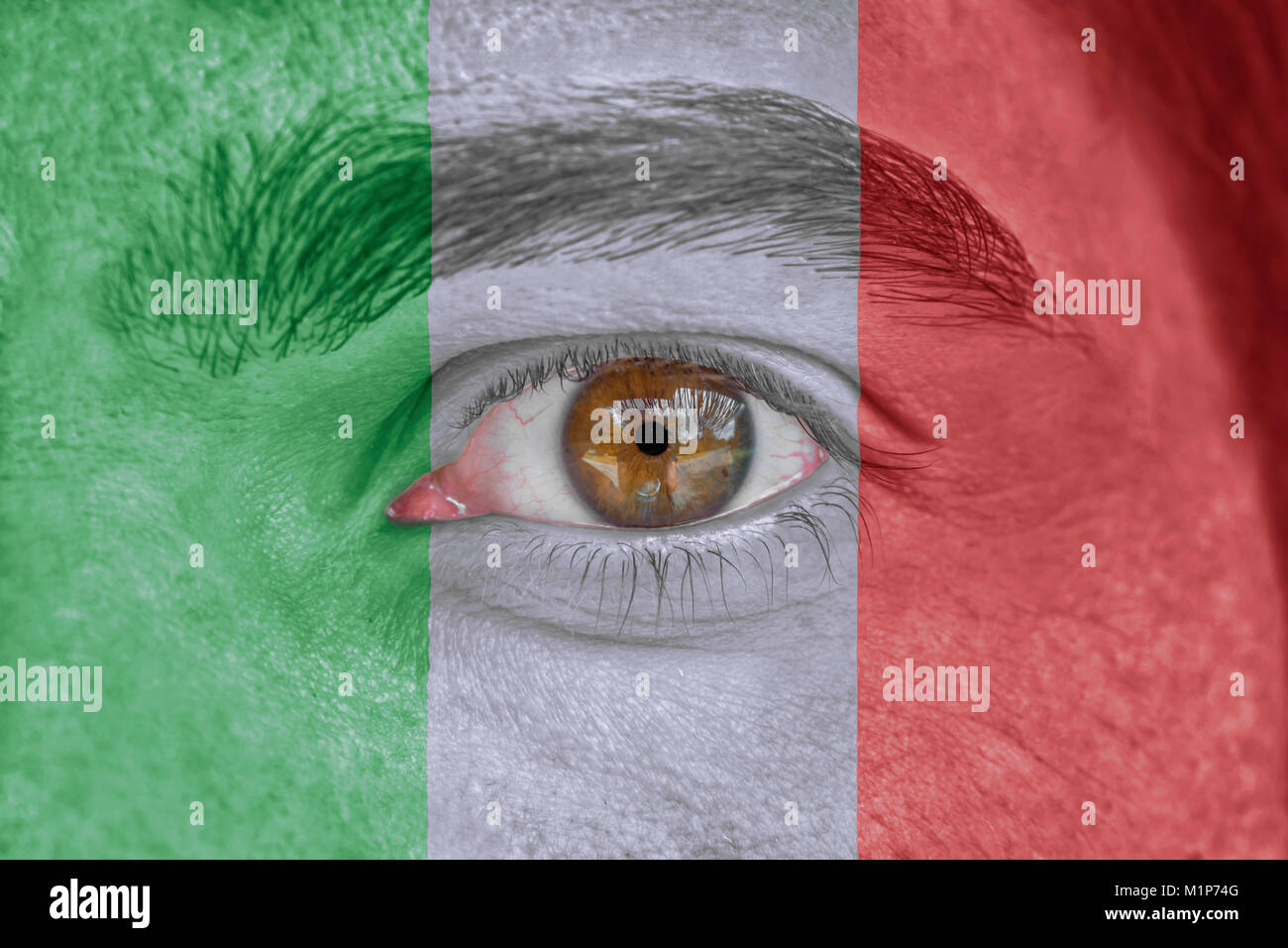 Human face and eye painted with flag of Italy Stock Photo - Alamy