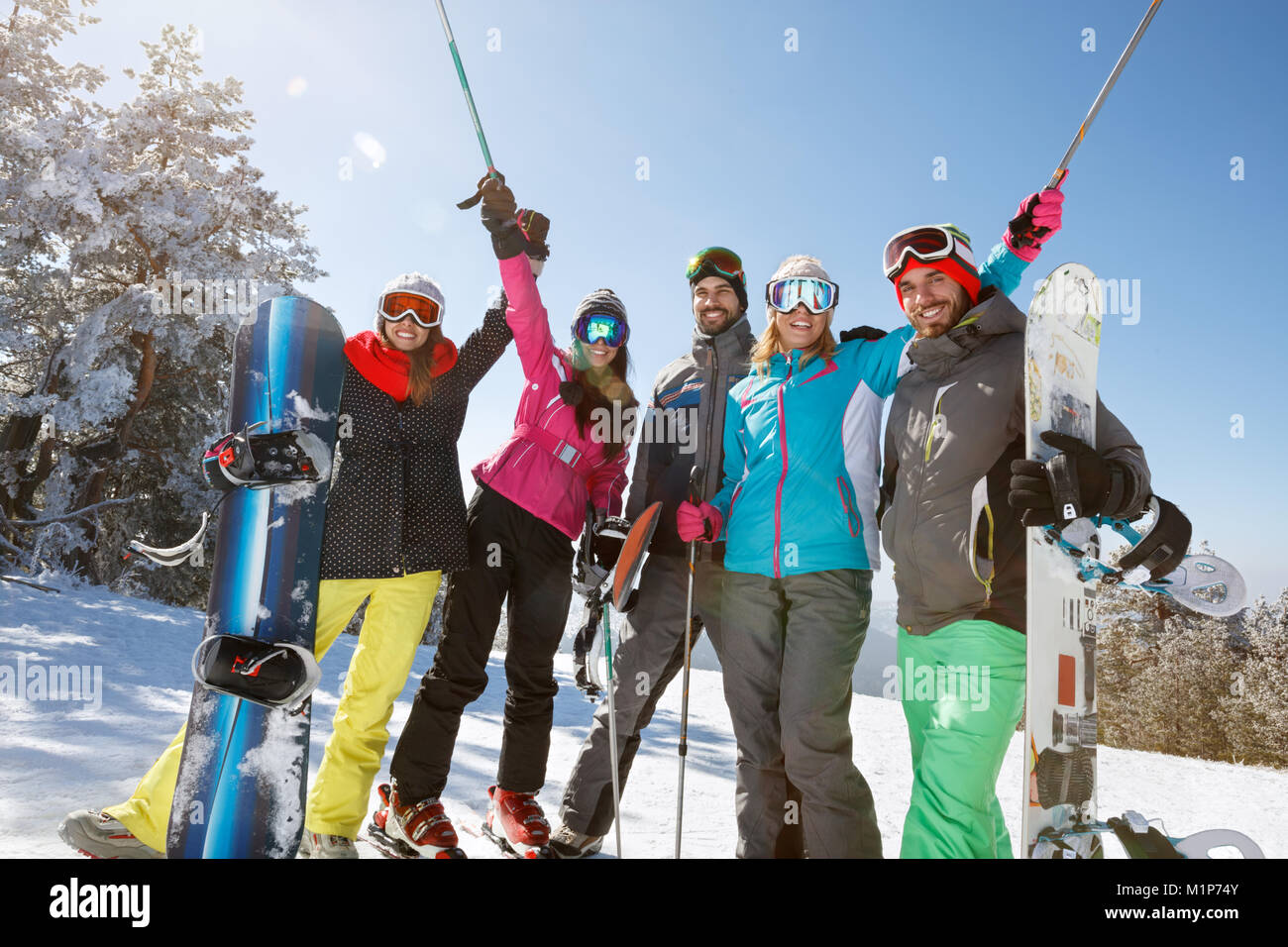 Group of cheerful friends on mountain skiing Stock Photo - Alamy