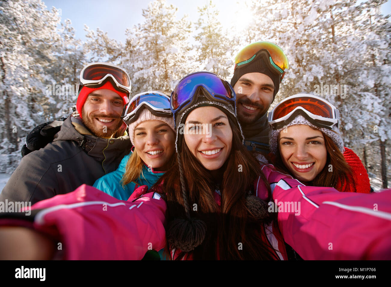 Group of cheerful friends making photo in nature Stock Photo - Alamy