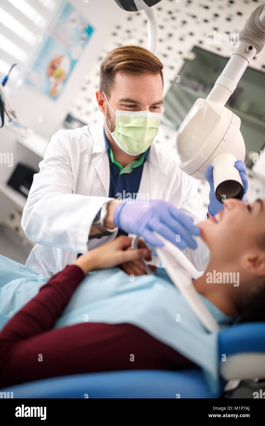 Dentist checkup patient on work Stock Photo - Alamy
