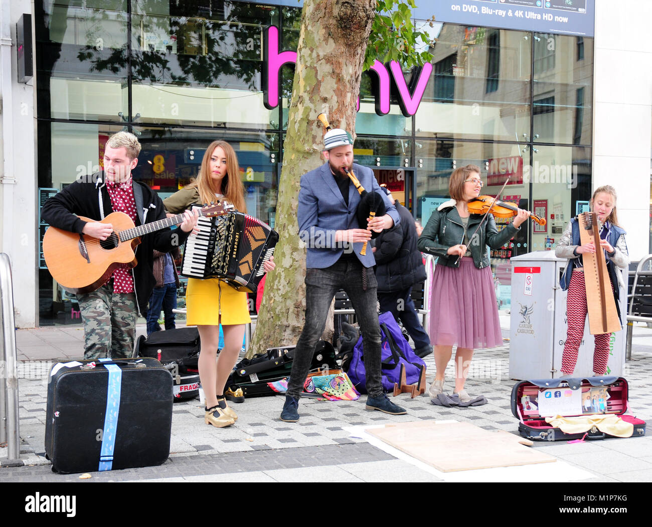 Folk group musicians playing in Cardiff shopping precinct Stock Photo ...