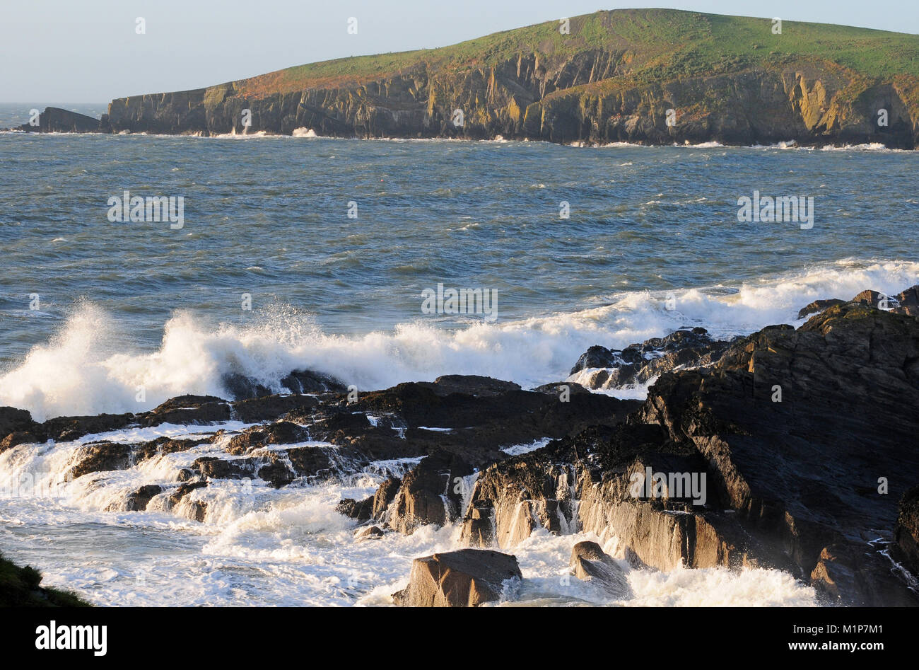 Rising tide at Gwbert. Part of Cardigan Island behind. Wales Stock ...