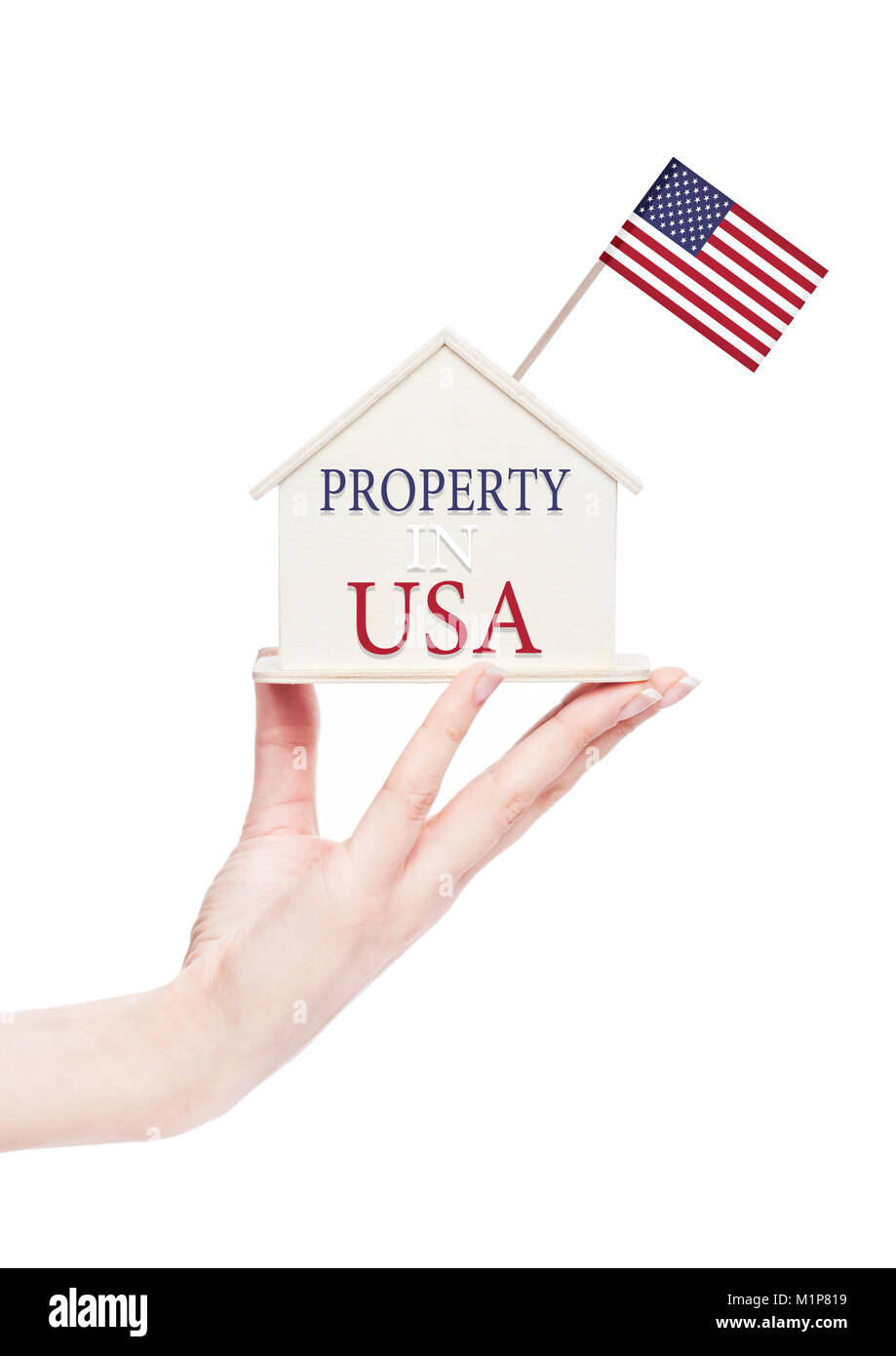 Female hand holding wooden house model with United States of America ...