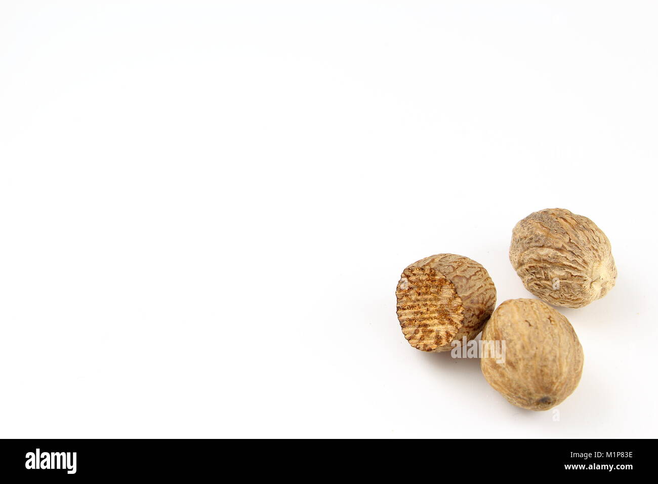 composition of nutmeg seeds isolated on a white background Stock Photo ...