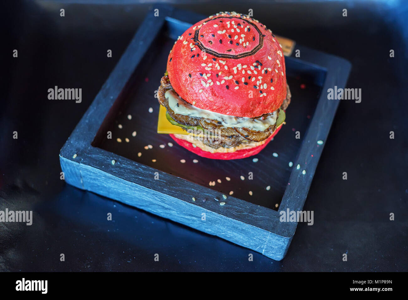 Red burger on a wooden board Stock Photo - Alamy