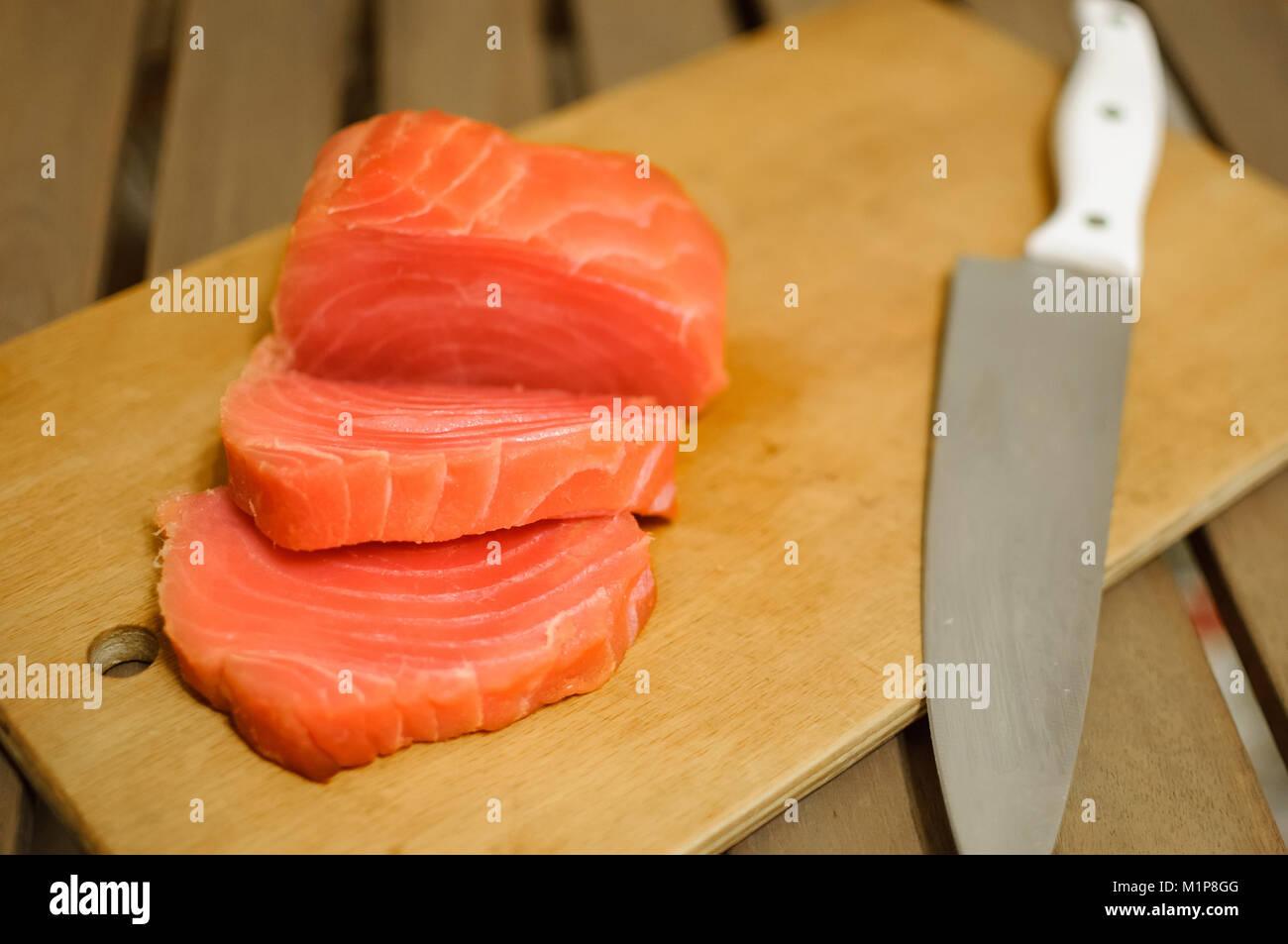 Sliced salmon fillet on cutting board Stock Photo - Alamy