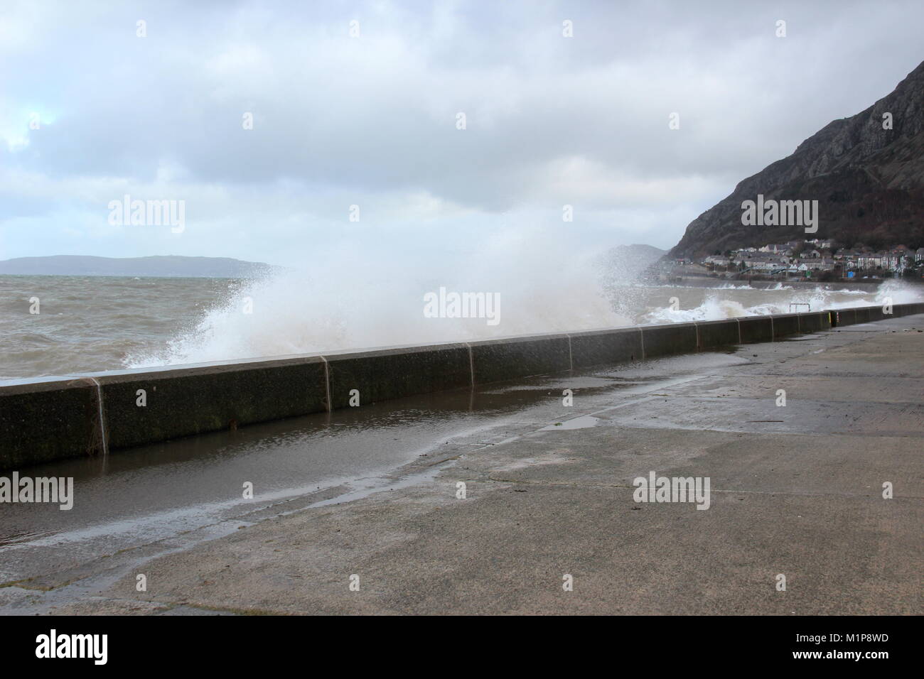 High winds and rough seas bring huge waves crashing in to the sea ...