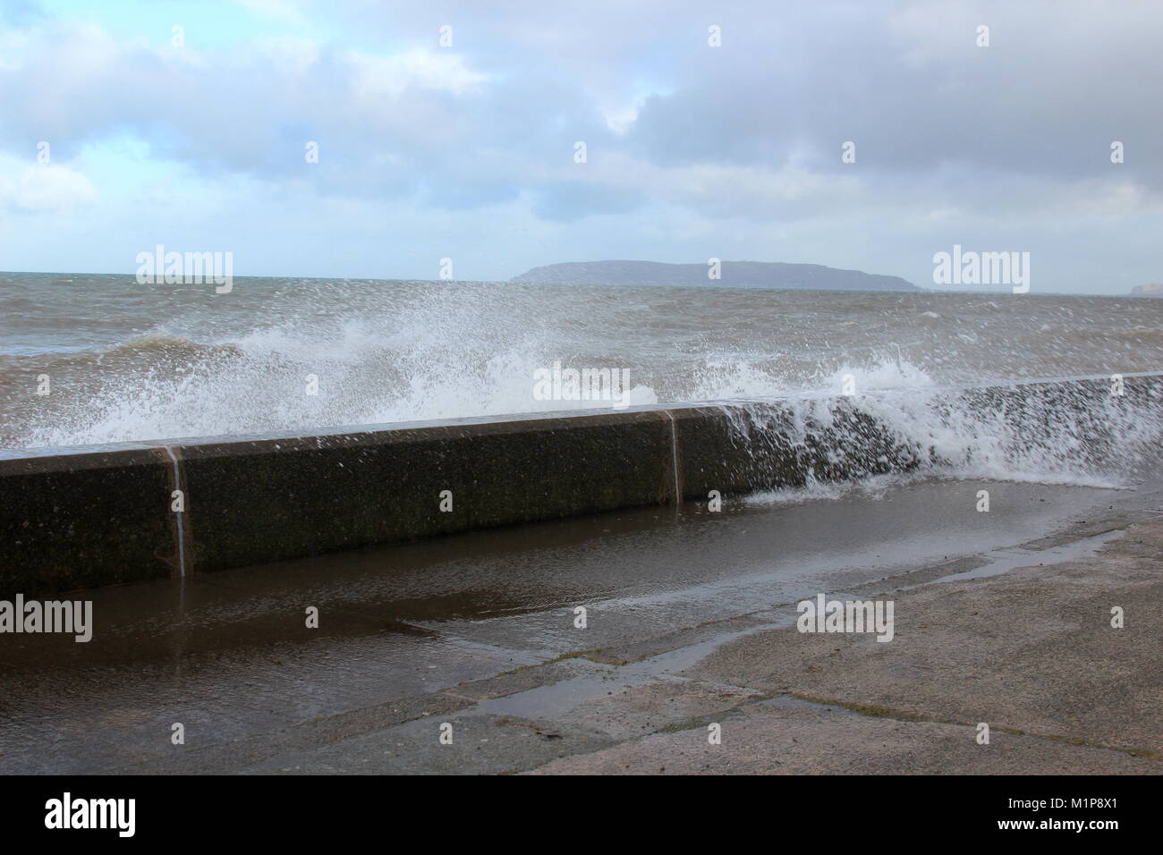 High winds and rough seas bring huge waves crashing in to the sea ...