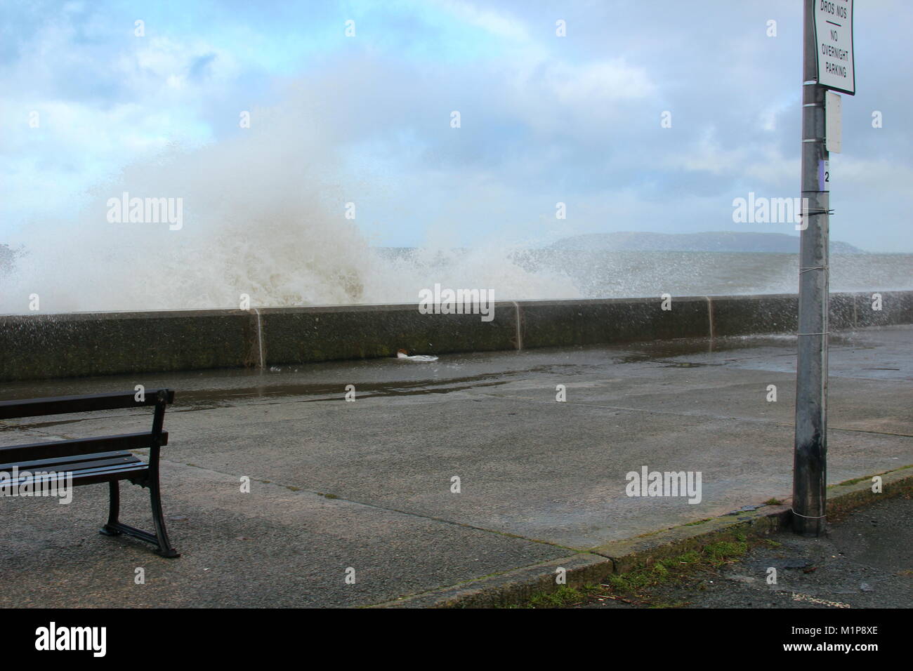 High winds and rough seas bring huge waves crashing in to the sea ...