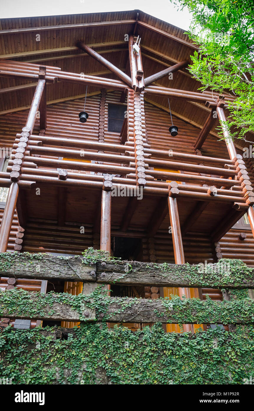 Log house - Cozy log house amongst green environment Stock Photo - Alamy