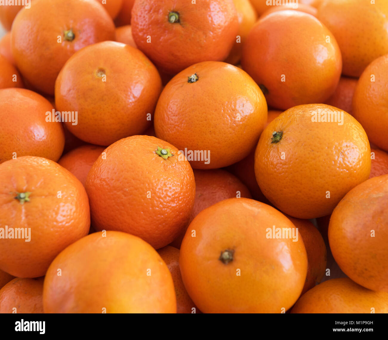 lot of ripe mandarins, background of mandarins Stock Photo - Alamy
