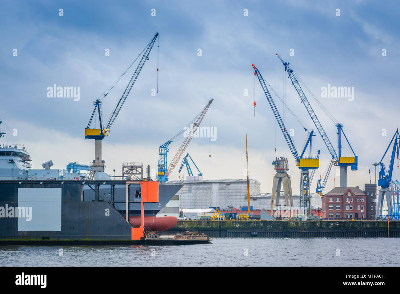 Docks in Hamburg (Germany) harbour with cranes Stock Photo - Alamy