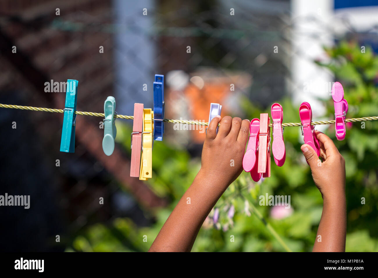 Girl Hanging Washing Line High Resolution Stock Photography and Images ...