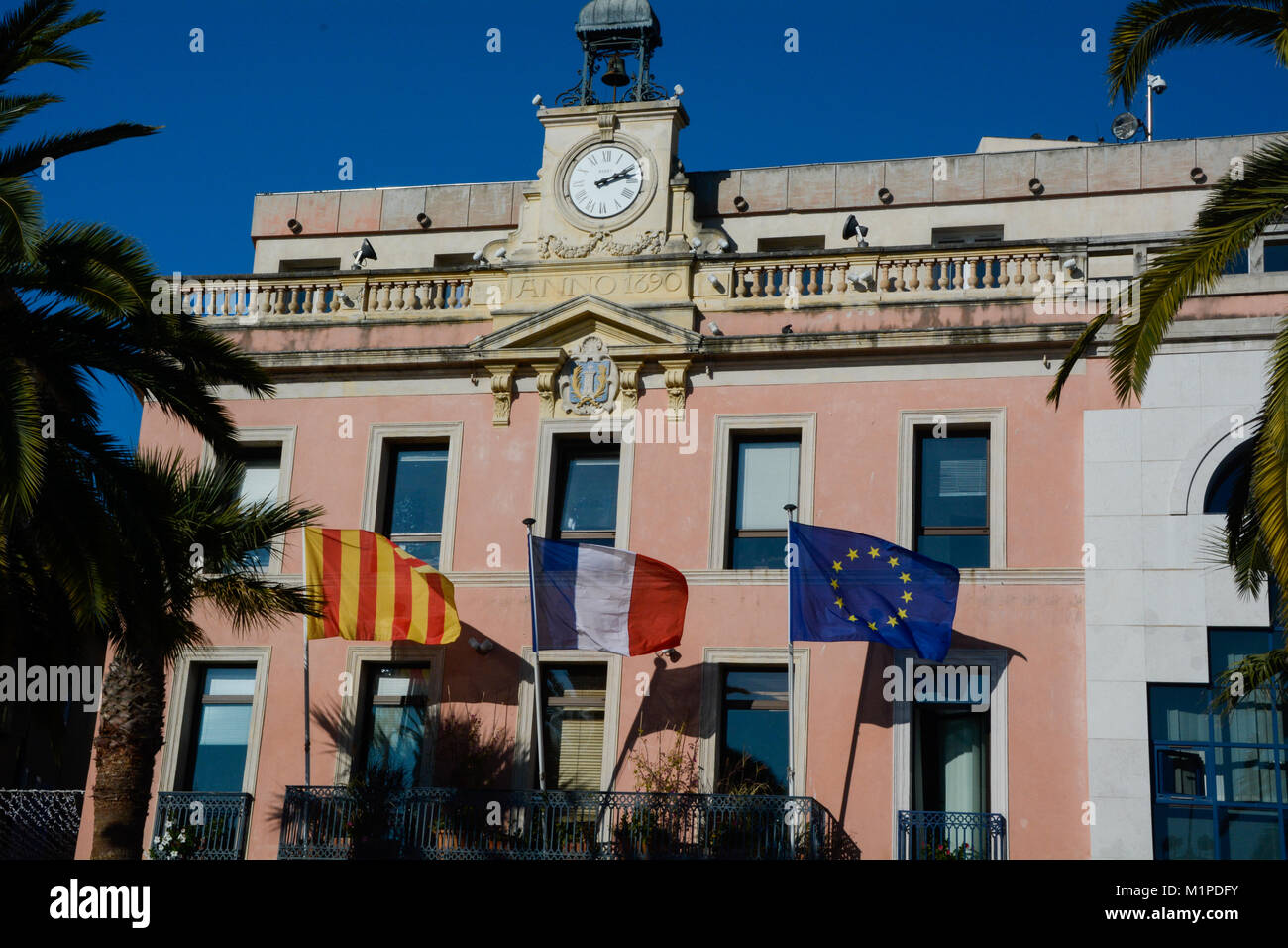The flags of Provence,France and the EU in the wind in front of the ...