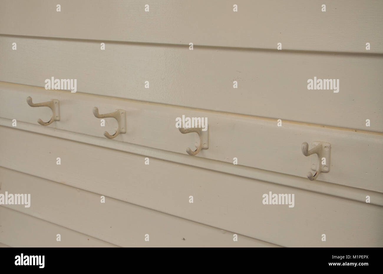Row Of Coat Hooks Stock Photo - Alamy