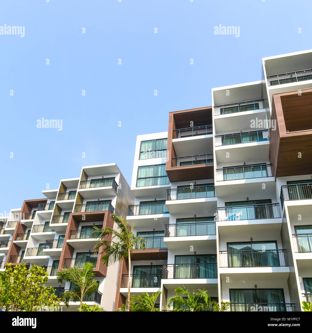 Modern beautiful luxury hotel resort building and blue sky in Pattaya ...