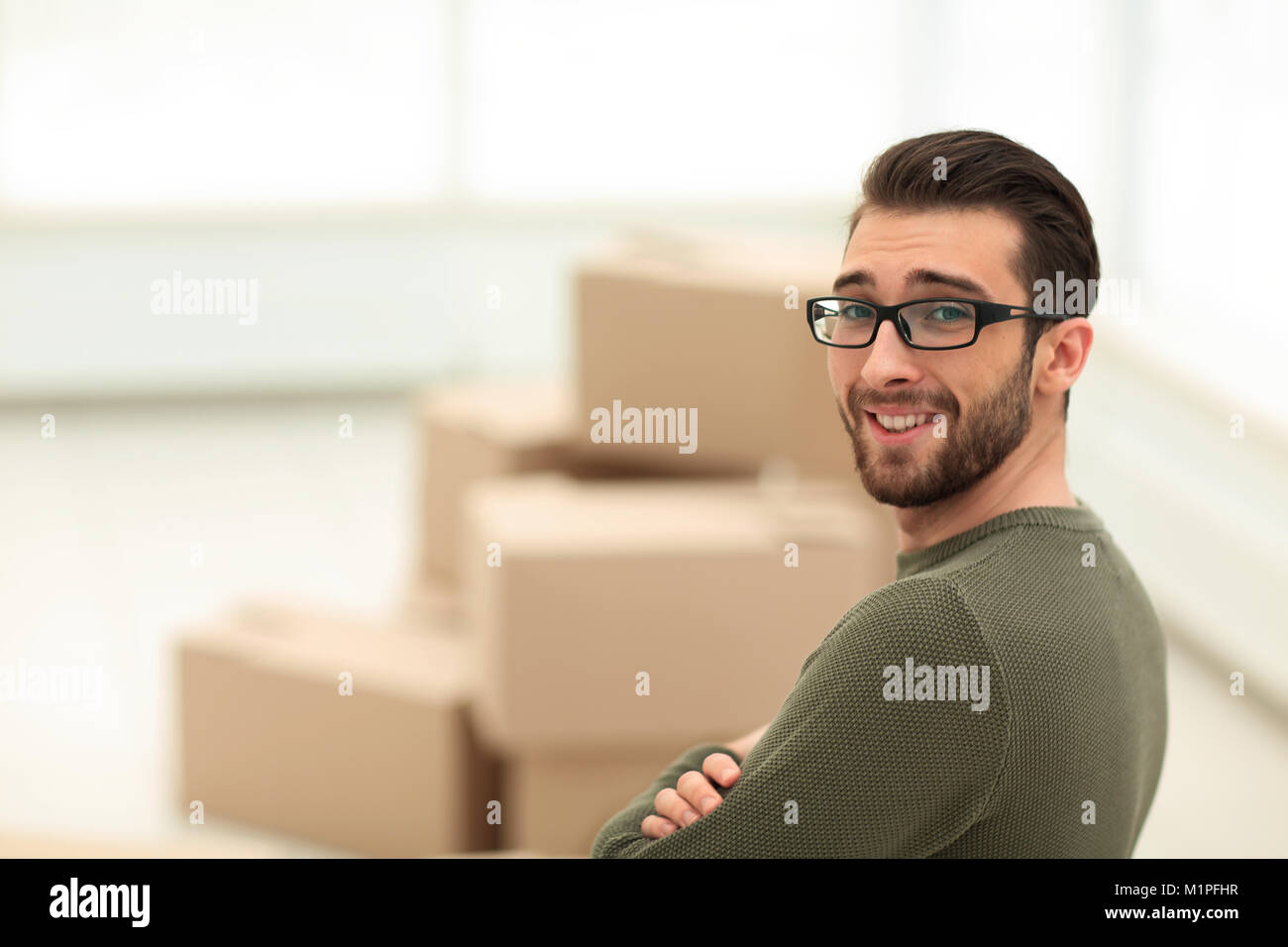 handsome man standing in new house Stock Photo - Alamy